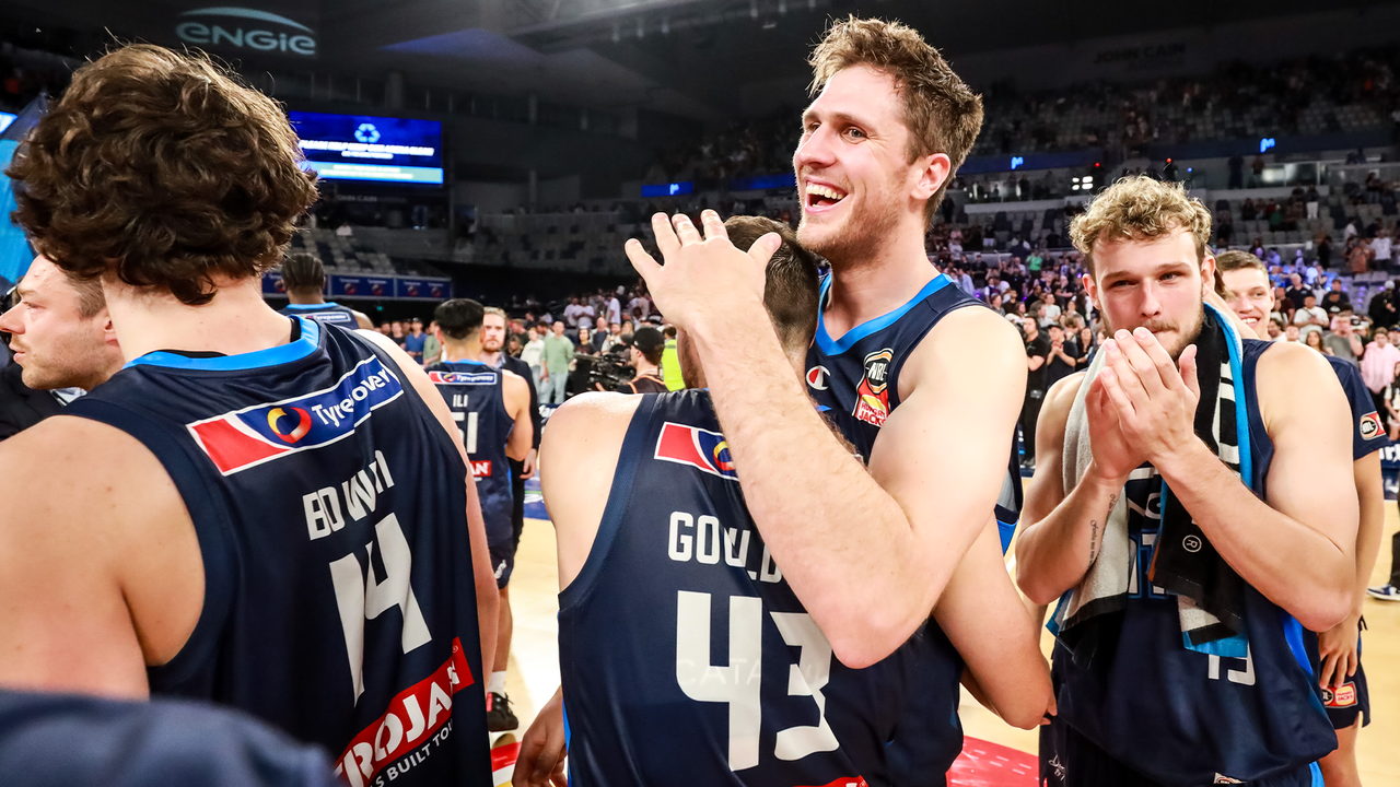 United celebrate Rob Loe as he departs the team